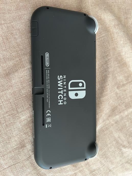 Nintendo Switch lite + Zelda botw + case