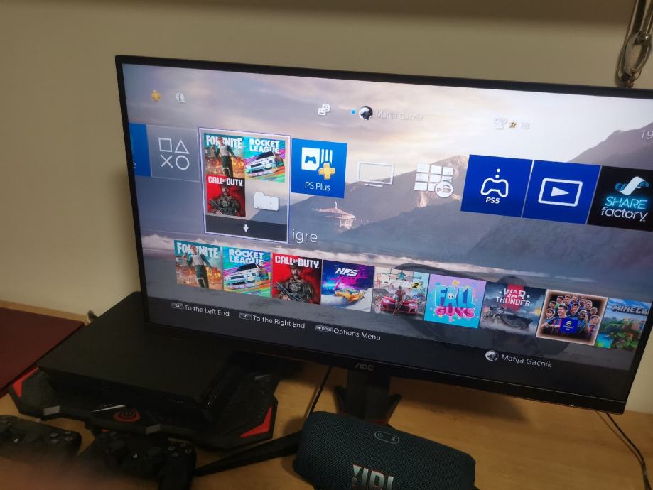 playstation 4 slim 1 terabyte + 5 iger + 2 kontrolerja