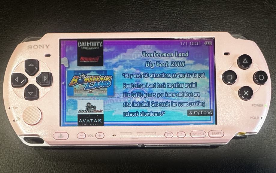 Sony PSP roza + Memory Stick Pro Duo 32GB + 50 iger, odklenjen