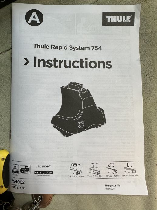 Thule 754 (noge) in kit 1754 (podnožje Škoda Rapid)