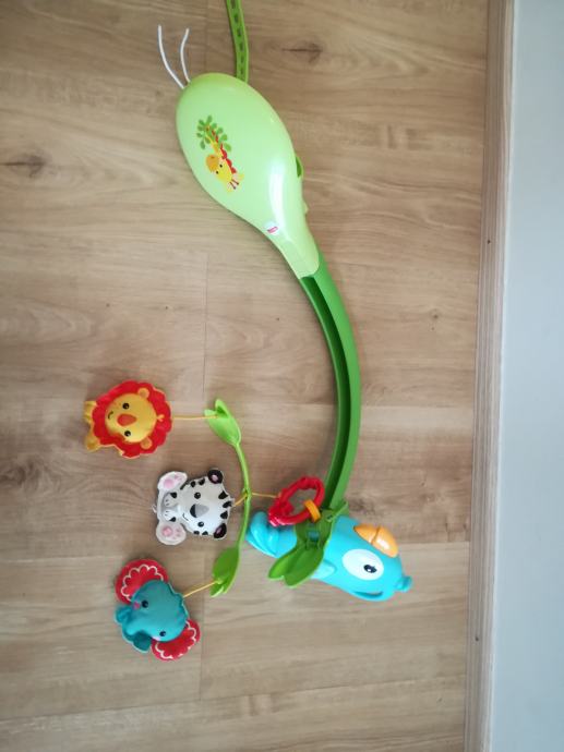 Fisher price glasbeni vrtiljak živali in pojoča papiga
