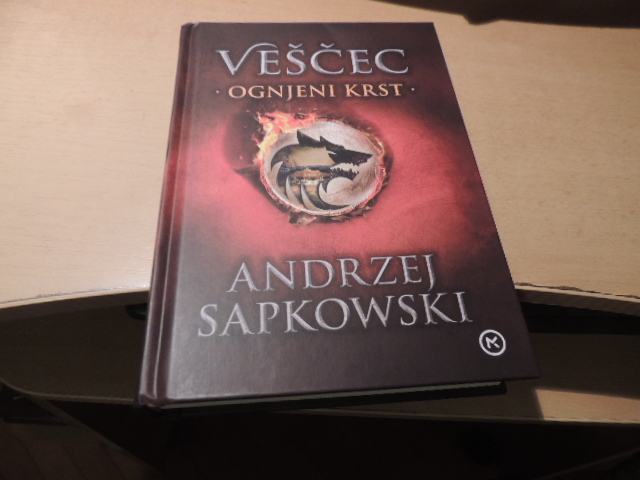 VEŠČEC: OGNJENI KRST A. SAPKOWSKI ZALOŽBA MLADINSKA KNJIGA 2024