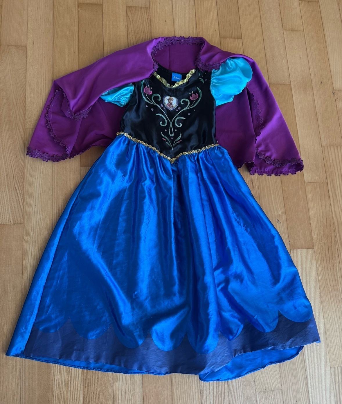 Pustni kostum Disney: Ana -Frozen vel 7-8 let
